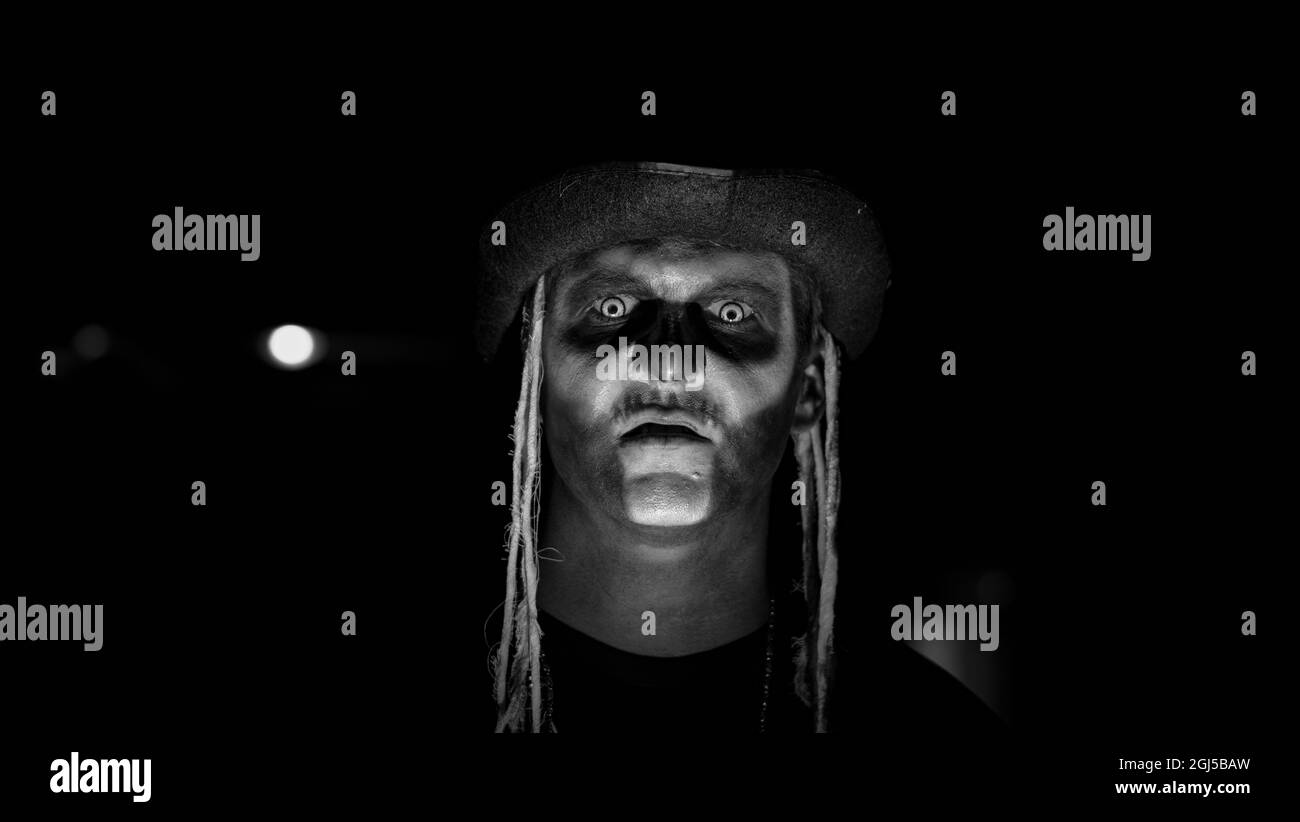 Scary man face in carnival skull Halloween makeup of skeleton looking ...