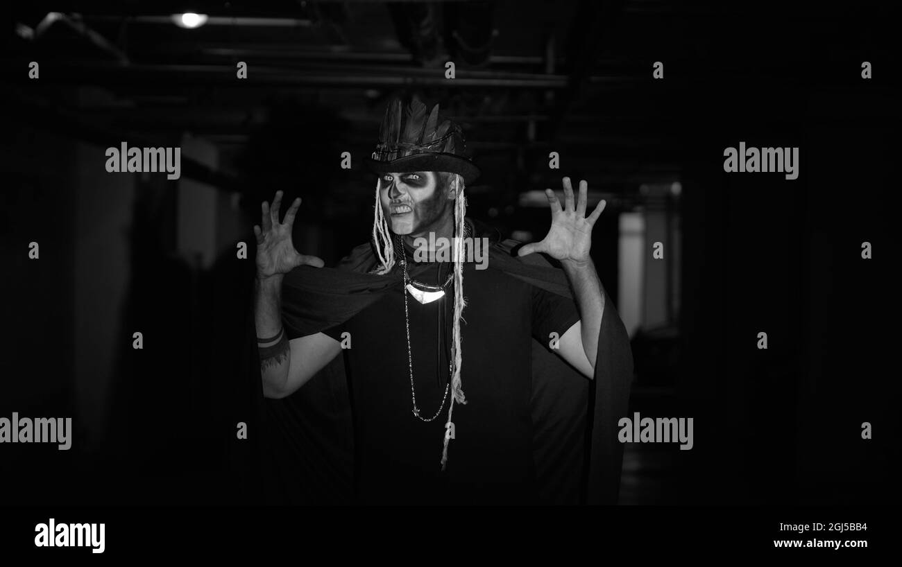 Scary man face in carnival skull Halloween makeup of skeleton looking ...