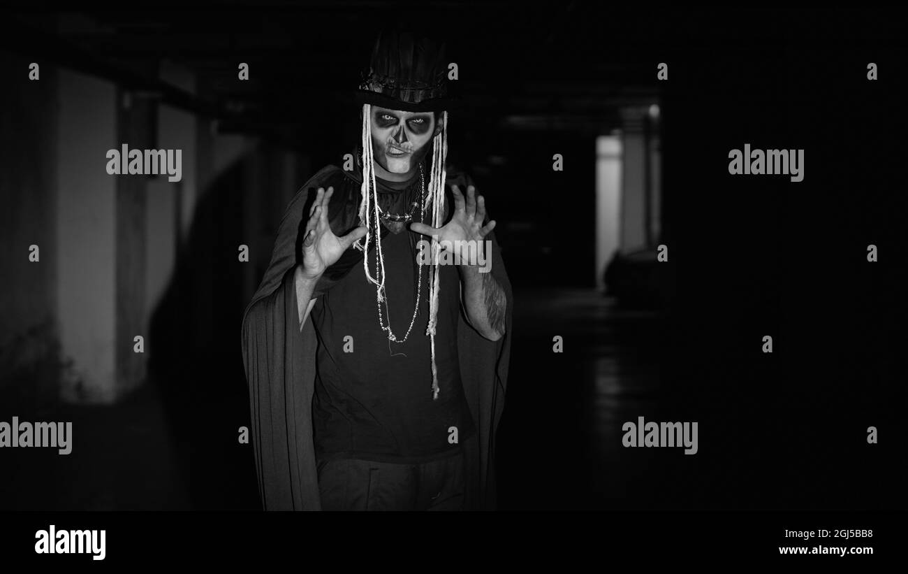 Scary man face in carnival skull Halloween makeup of skeleton looking ...