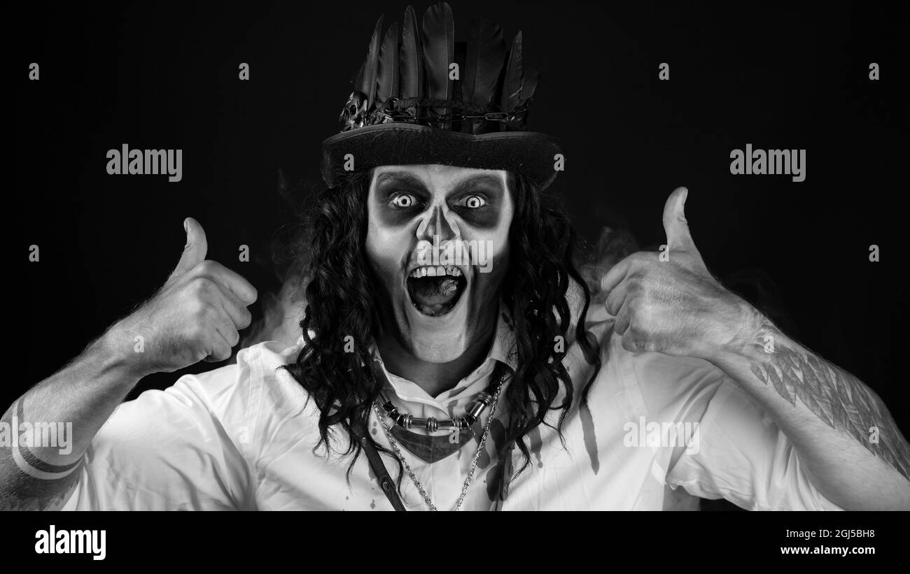 Frightening smiling man in skeleton Halloween costume showing thumbs up ...