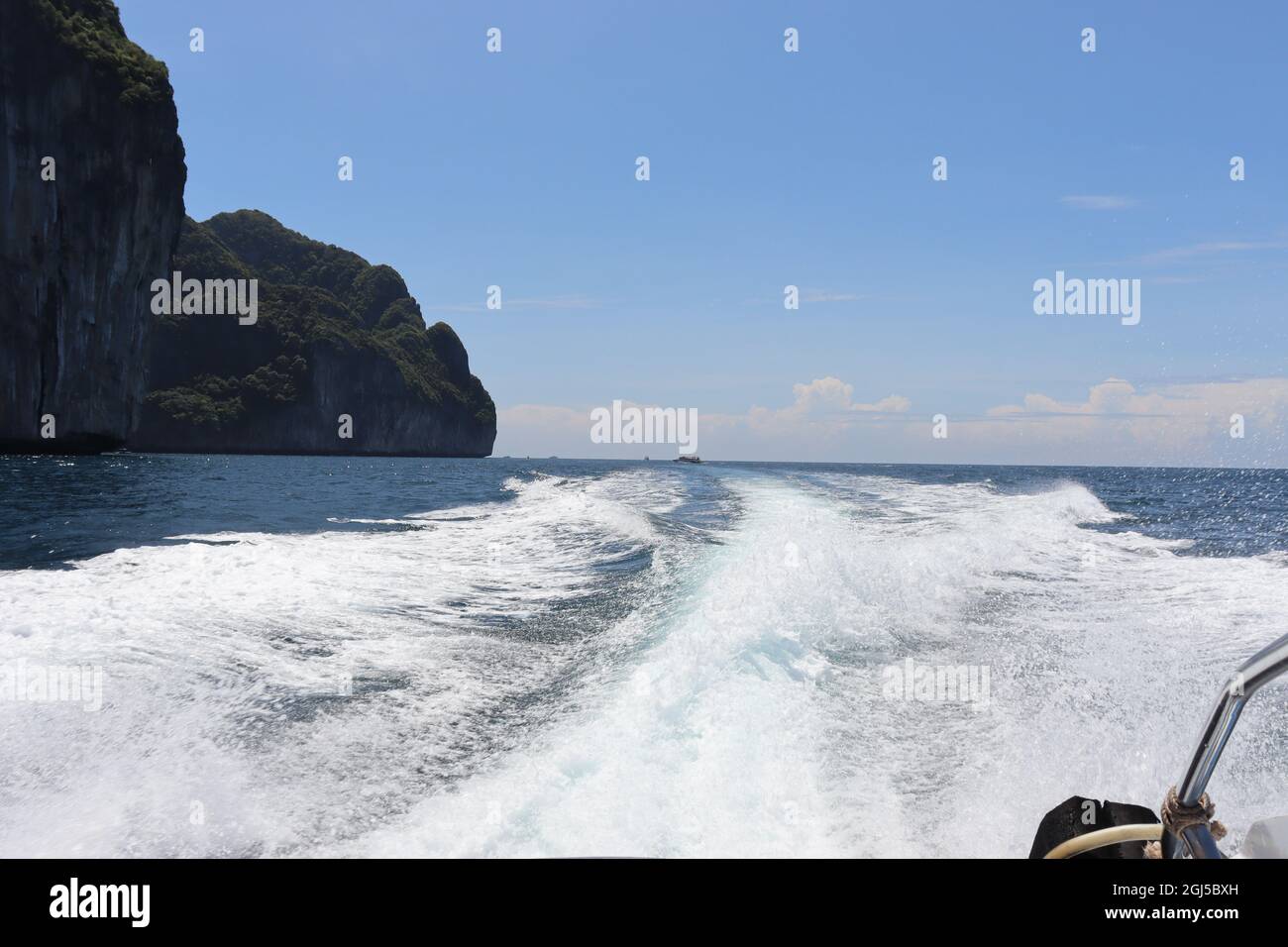 Boating near tropical islands waves and splashes Stock Photo - Alamy