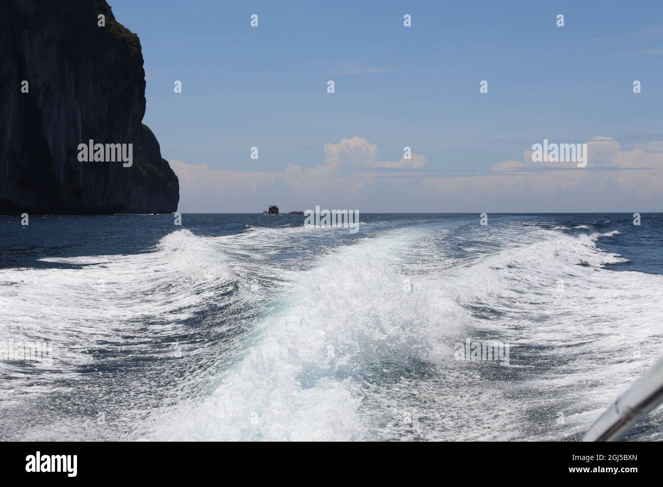 Boating near tropical islands waves and splashes Stock Photo - Alamy