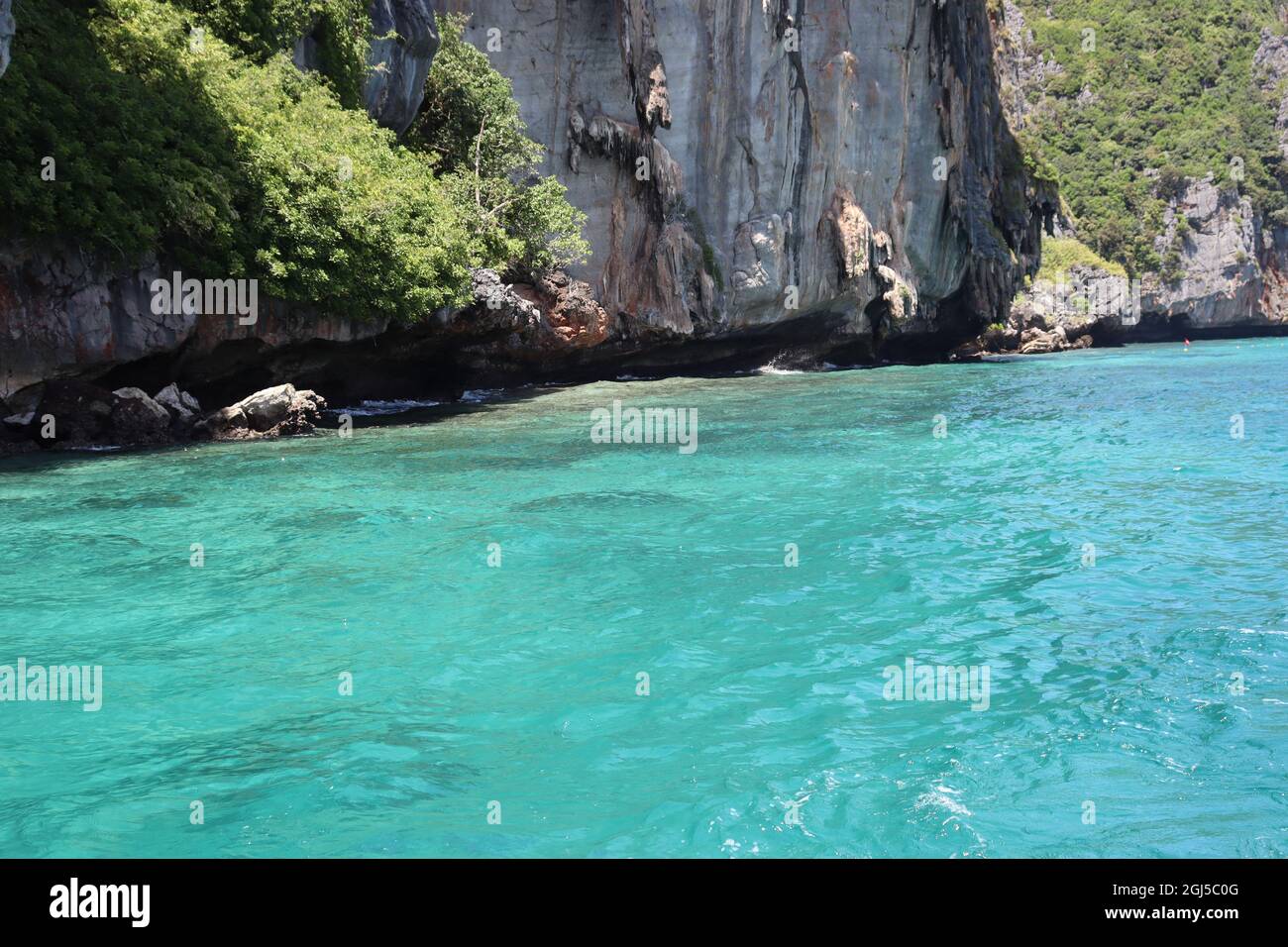 Boating near tropical islands waves and splashes Stock Photo - Alamy