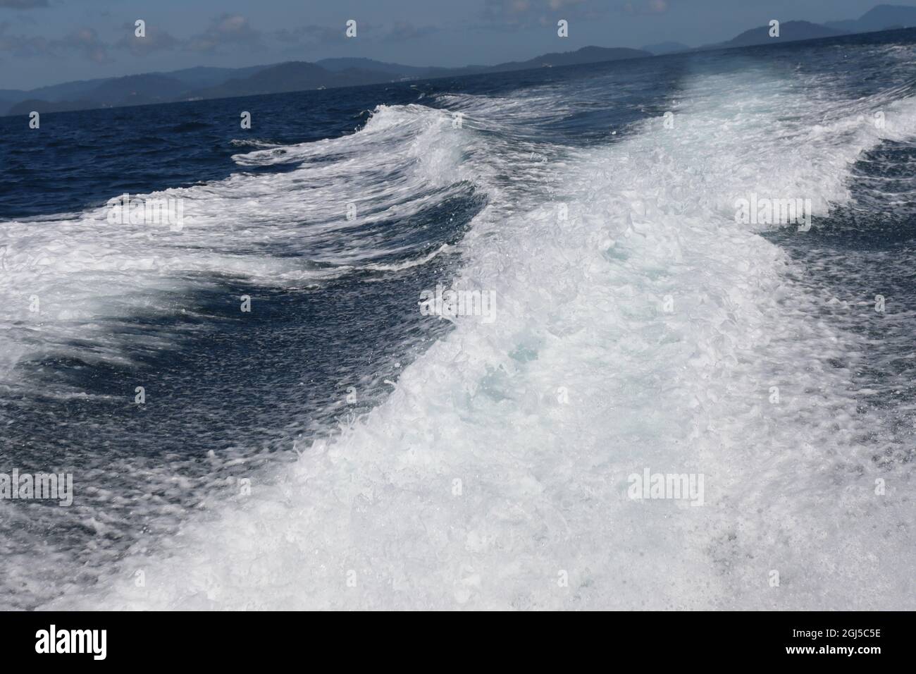 Boating near tropical islands waves and splashes Stock Photo - Alamy
