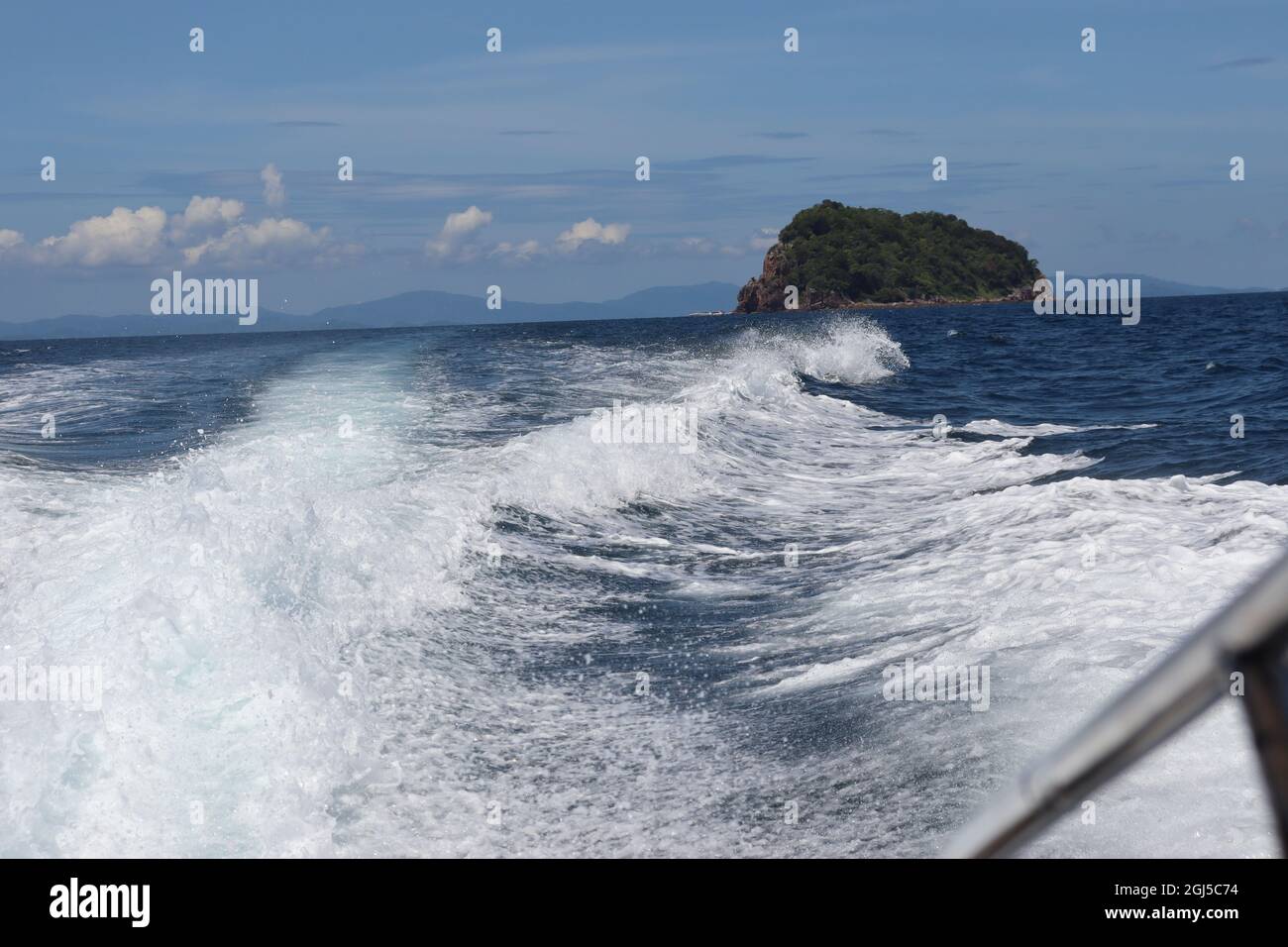 Boating near tropical islands waves and splashes Stock Photo - Alamy