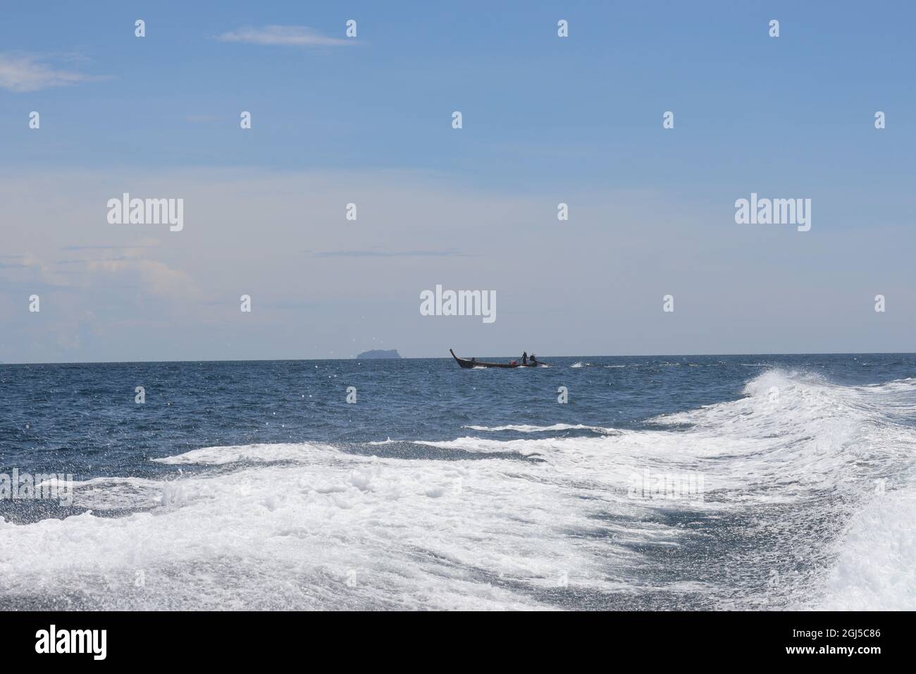 Boating near tropical islands waves and splashes Stock Photo - Alamy
