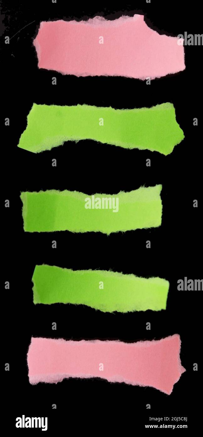 Color torn paper on black background Stock Photo - Alamy