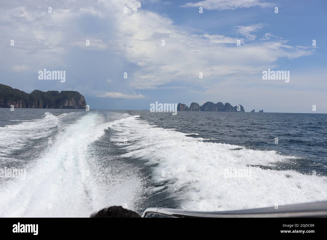 Boating near tropical islands waves and splashes Stock Photo - Alamy