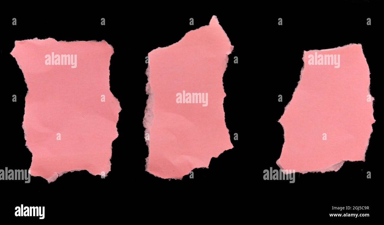 Color torn paper on black background Stock Photo - Alamy
