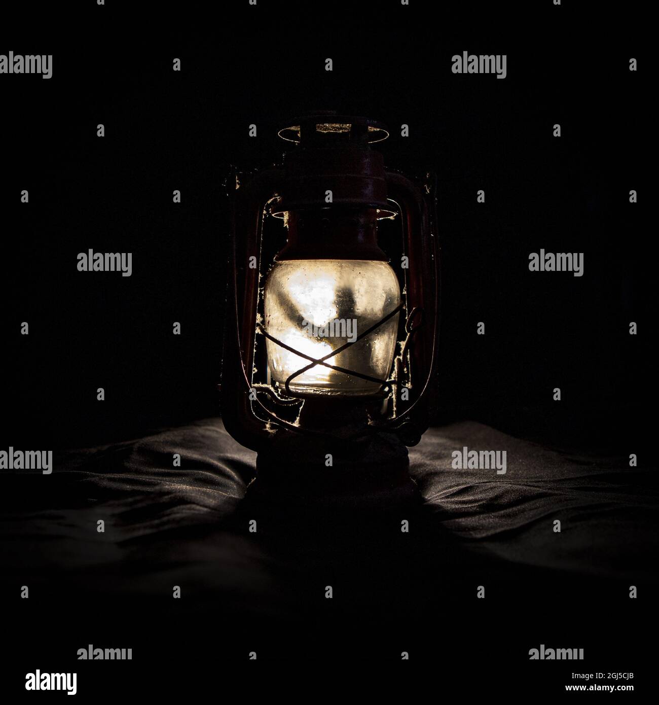 human figure inside an old lantern, trapped Stock Photo - Alamy