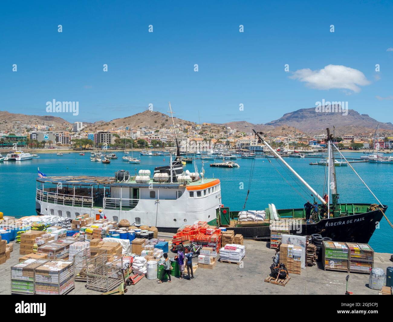 The harbor, a ship is loaded. City Mindelo, a seaport on the island Sao ...