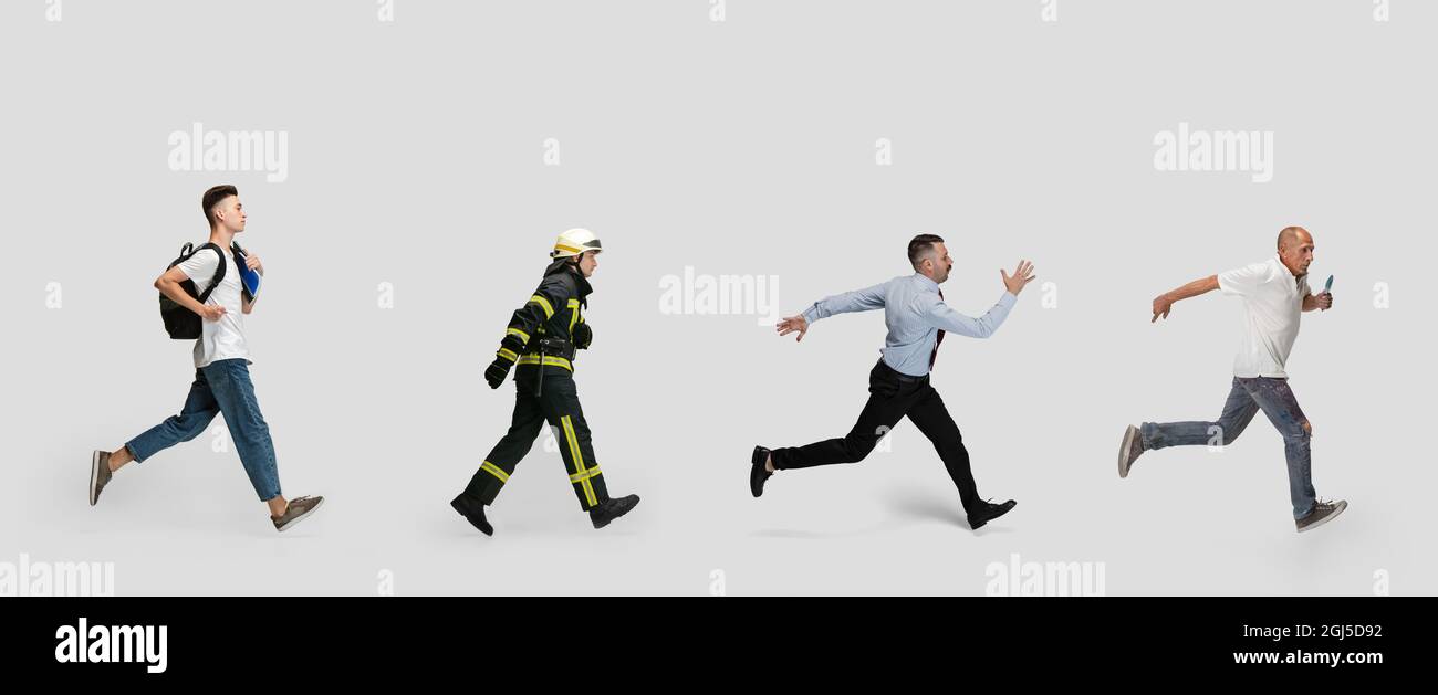 Full-length image of four different people running in a line isolated ...