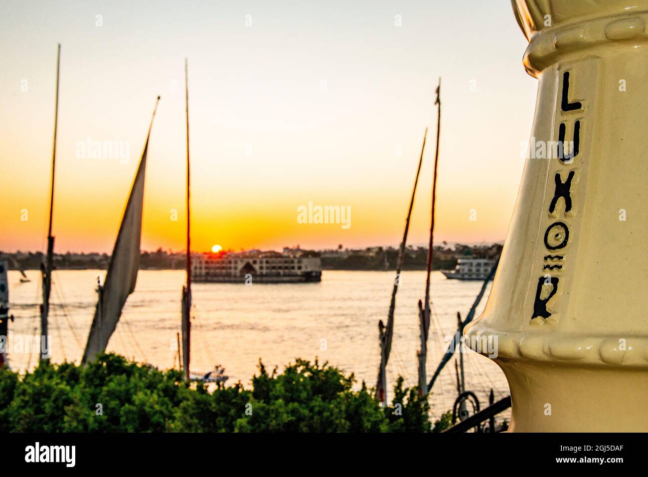 Egypt, Luxor (Thebes), view of Nile River and felucca masts and sails ...