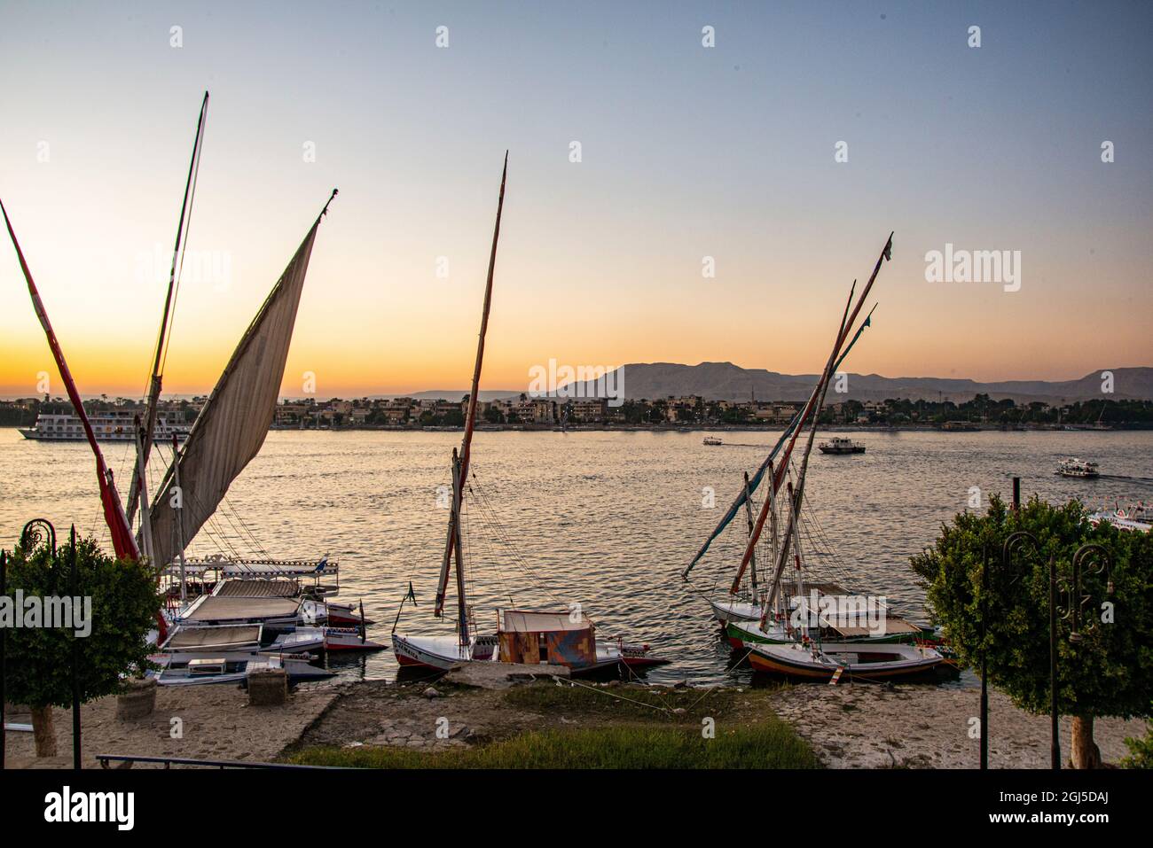 Egypt, Luxor (Thebes), view of Nile River and felucca masts and sails ...