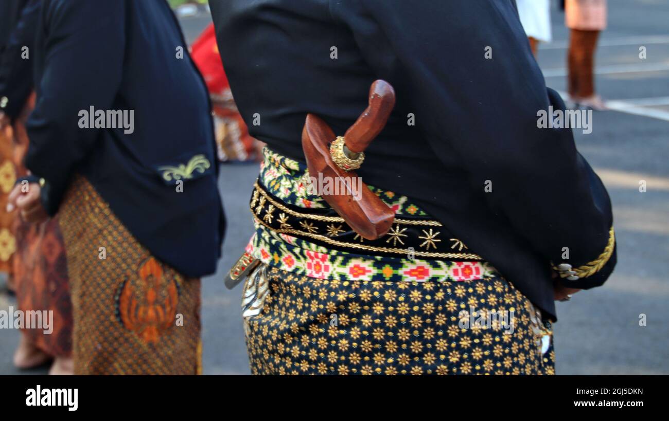 Men wearing traditional Javanese attire with keris Stock Photo - Alamy