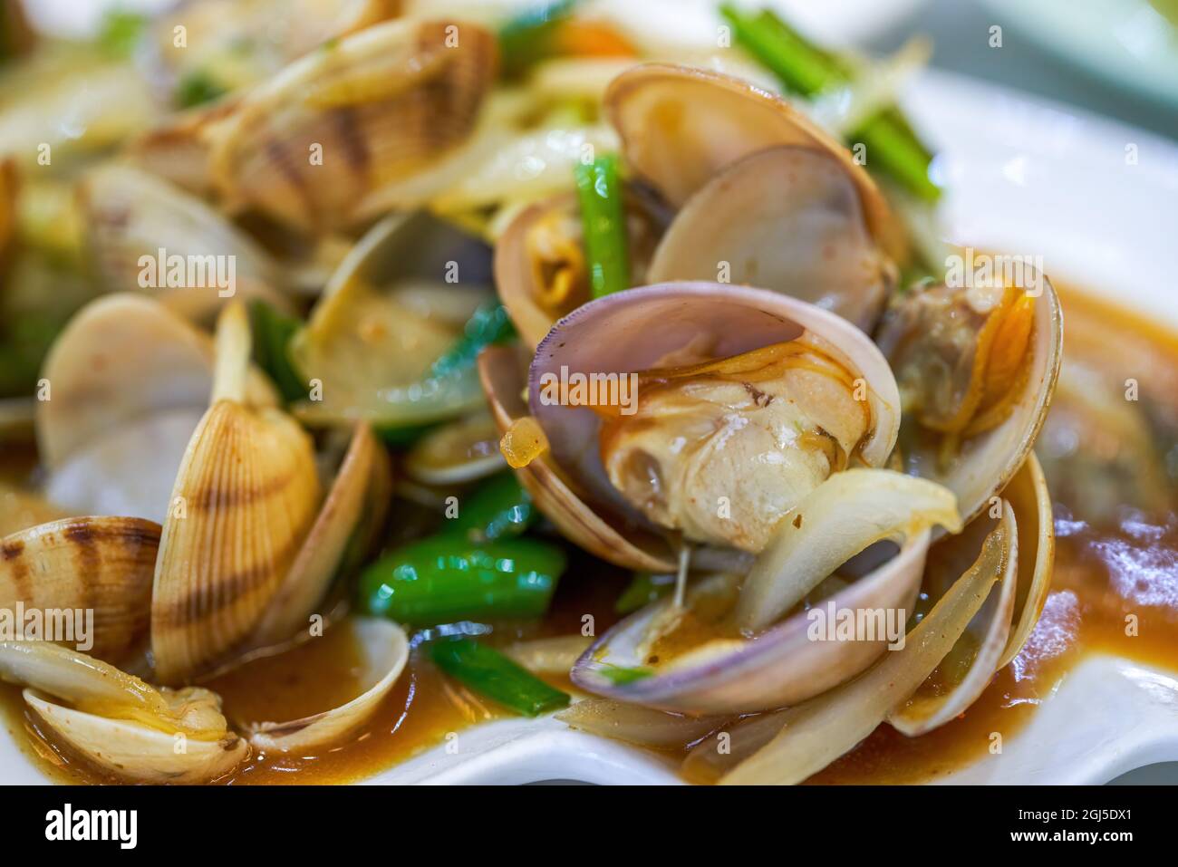 A dish of delicious fragrant fried flower conch seafood Stock Photo - Alamy