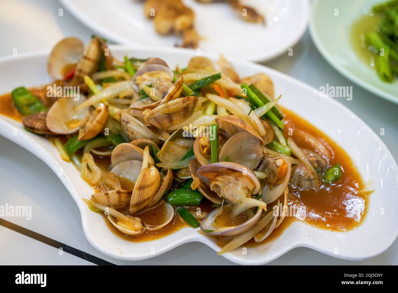 A dish of delicious fragrant fried flower conch seafood Stock Photo - Alamy
