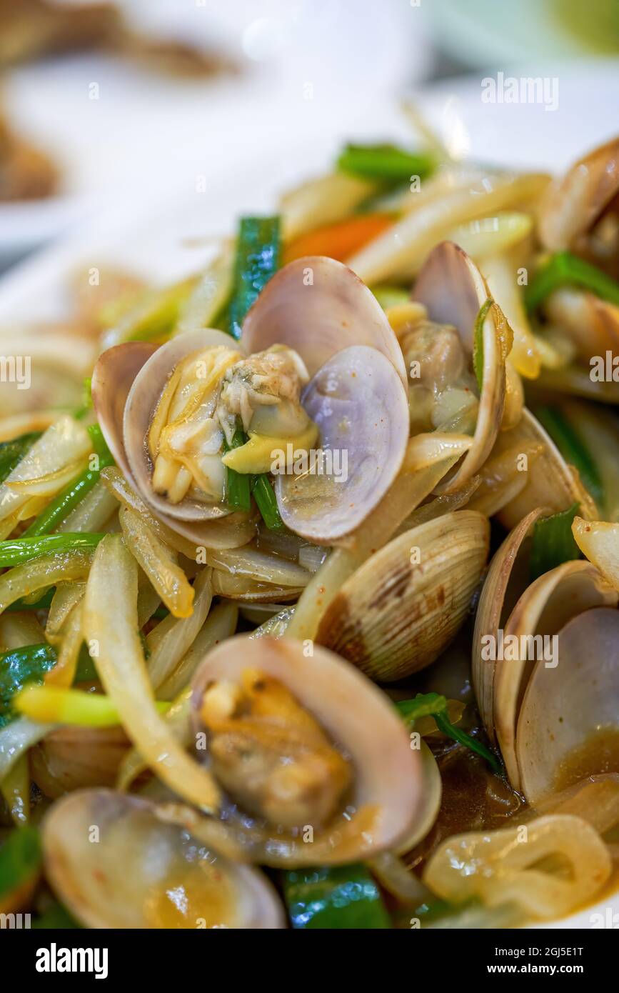 A dish of delicious fragrant fried flower conch seafood Stock Photo - Alamy