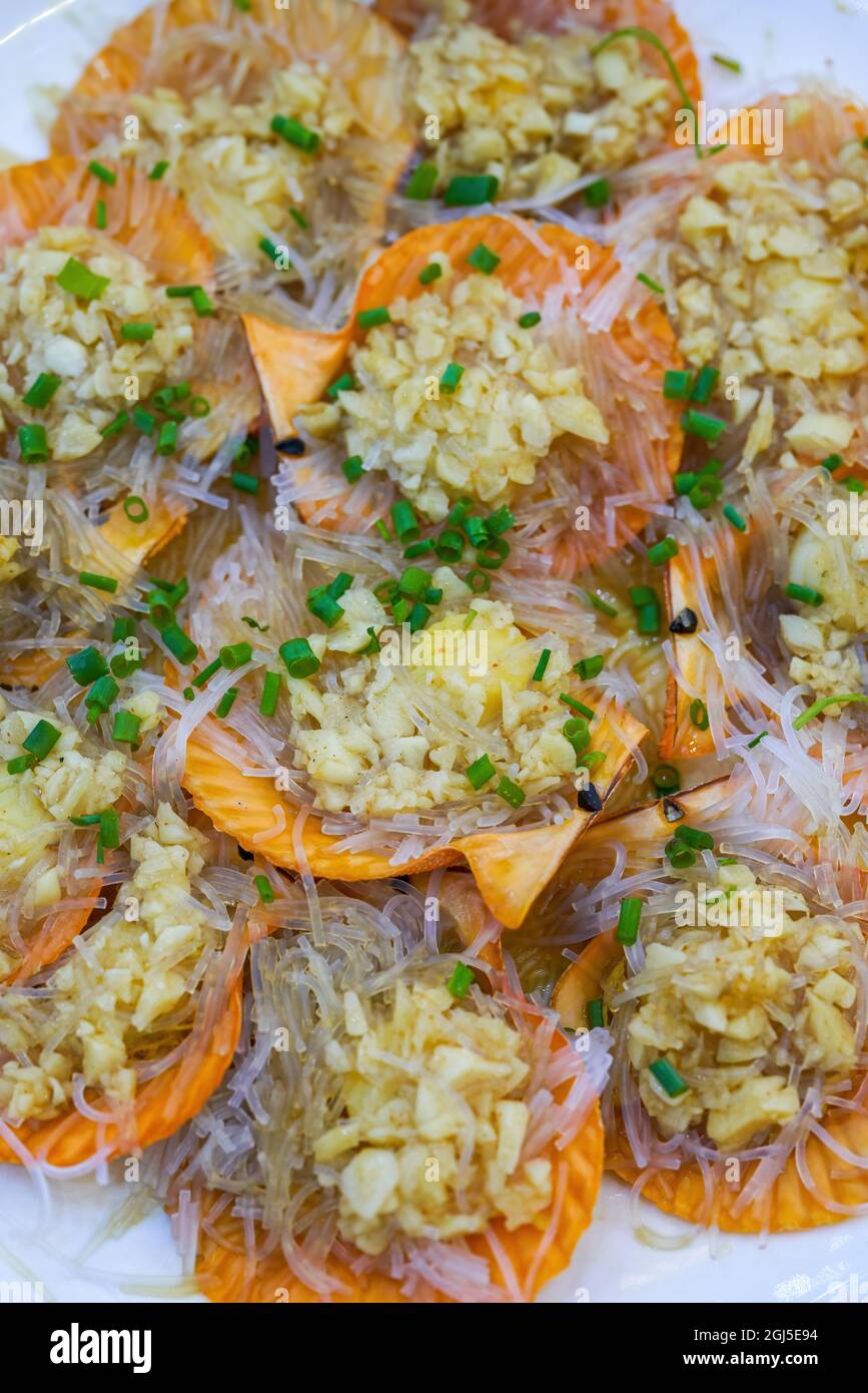 A dish of delicious garlic steamed scallops seafood Stock Photo - Alamy