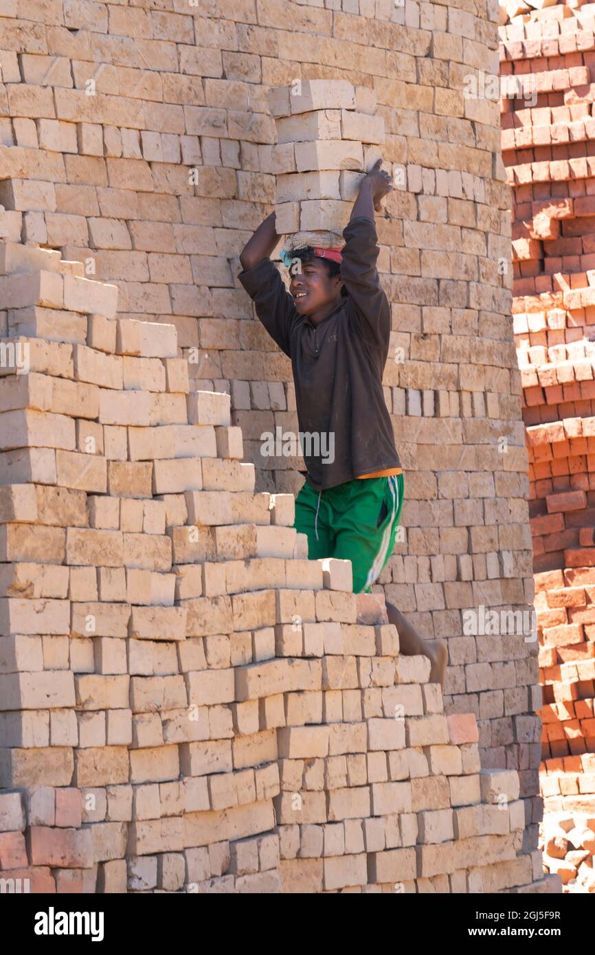 Man carrying bricks hi-res stock photography and images - Alamy