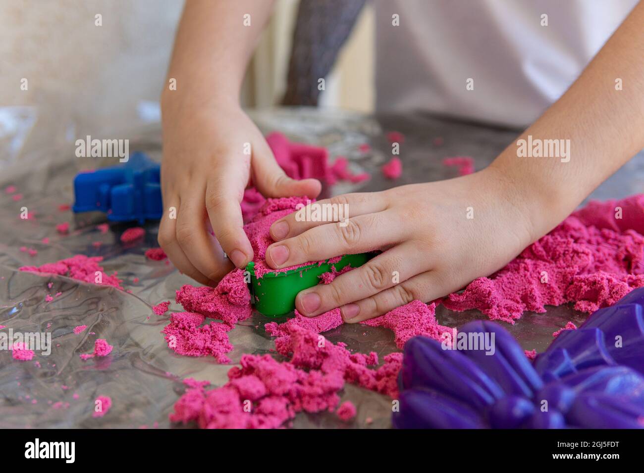 Kids playing in sand table hi-res stock photography and images - Alamy
