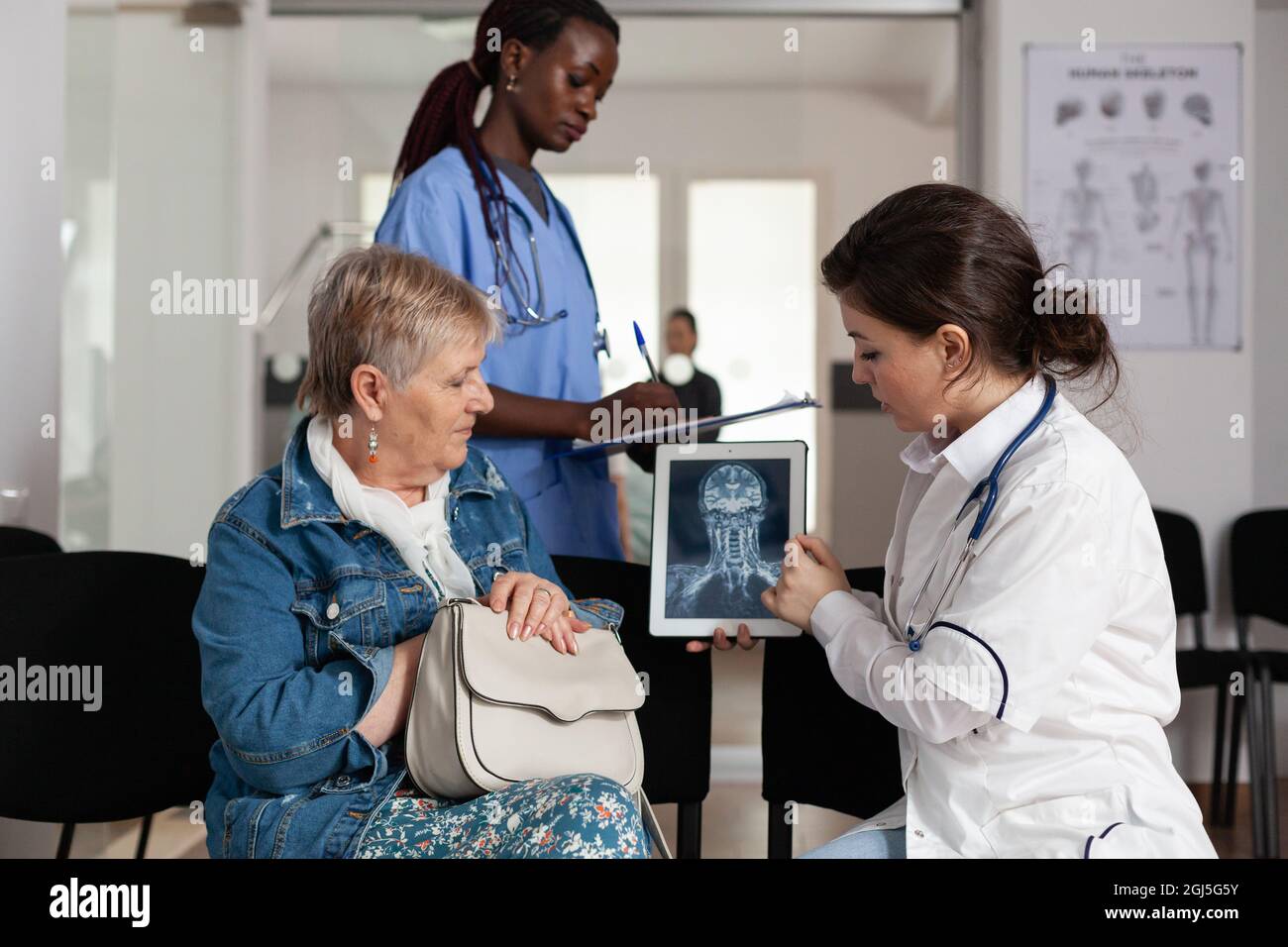 Radiologist doctor analyzing medical radiography with elderly sick ...