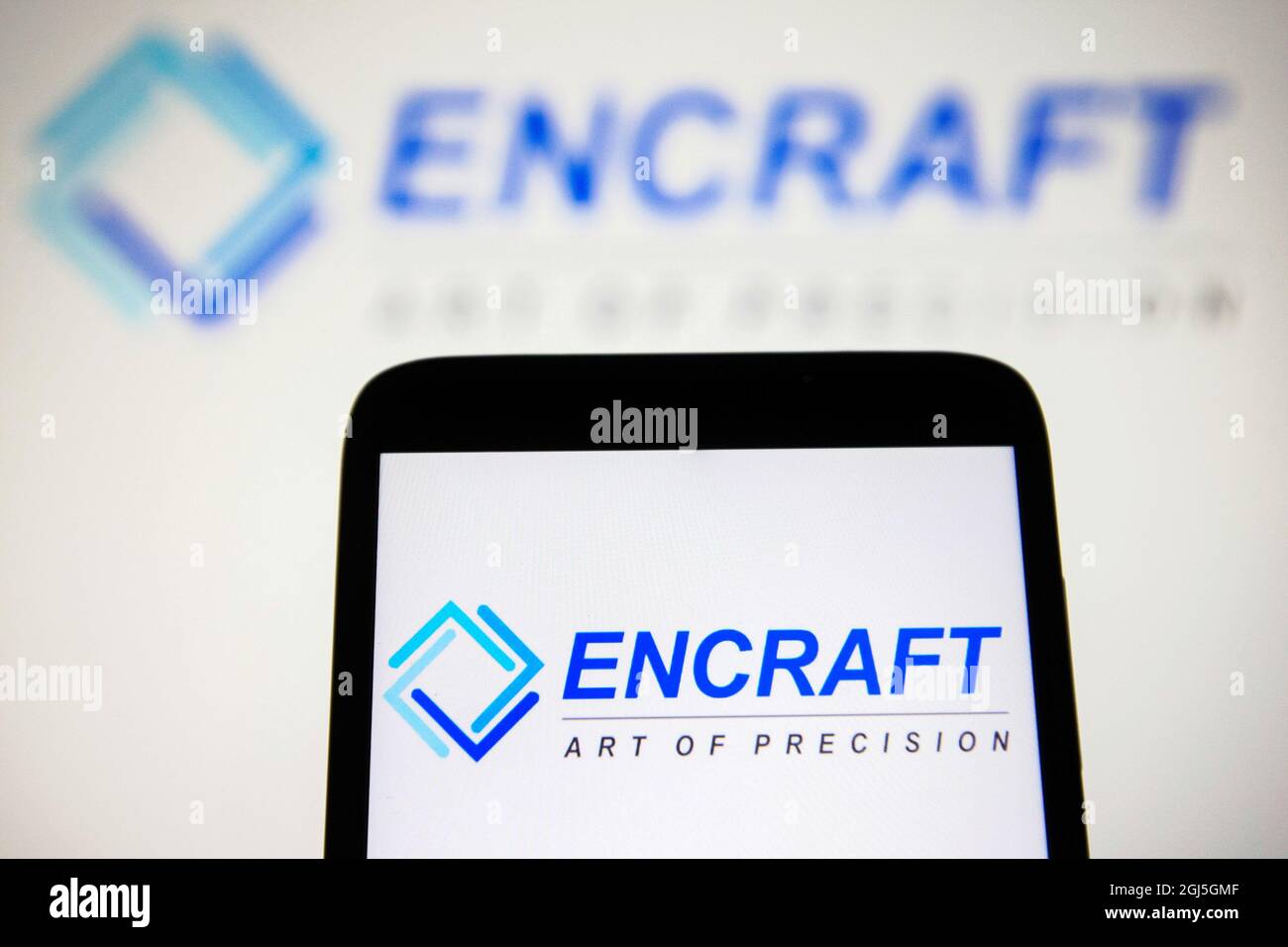In this photo illustration, Encraft logo is seen on a smartphone and a ...