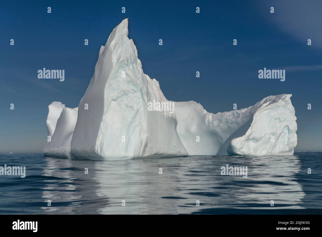 Antarctica, South Georgia Island, Stromness Bay. Iceberg reflects in ...