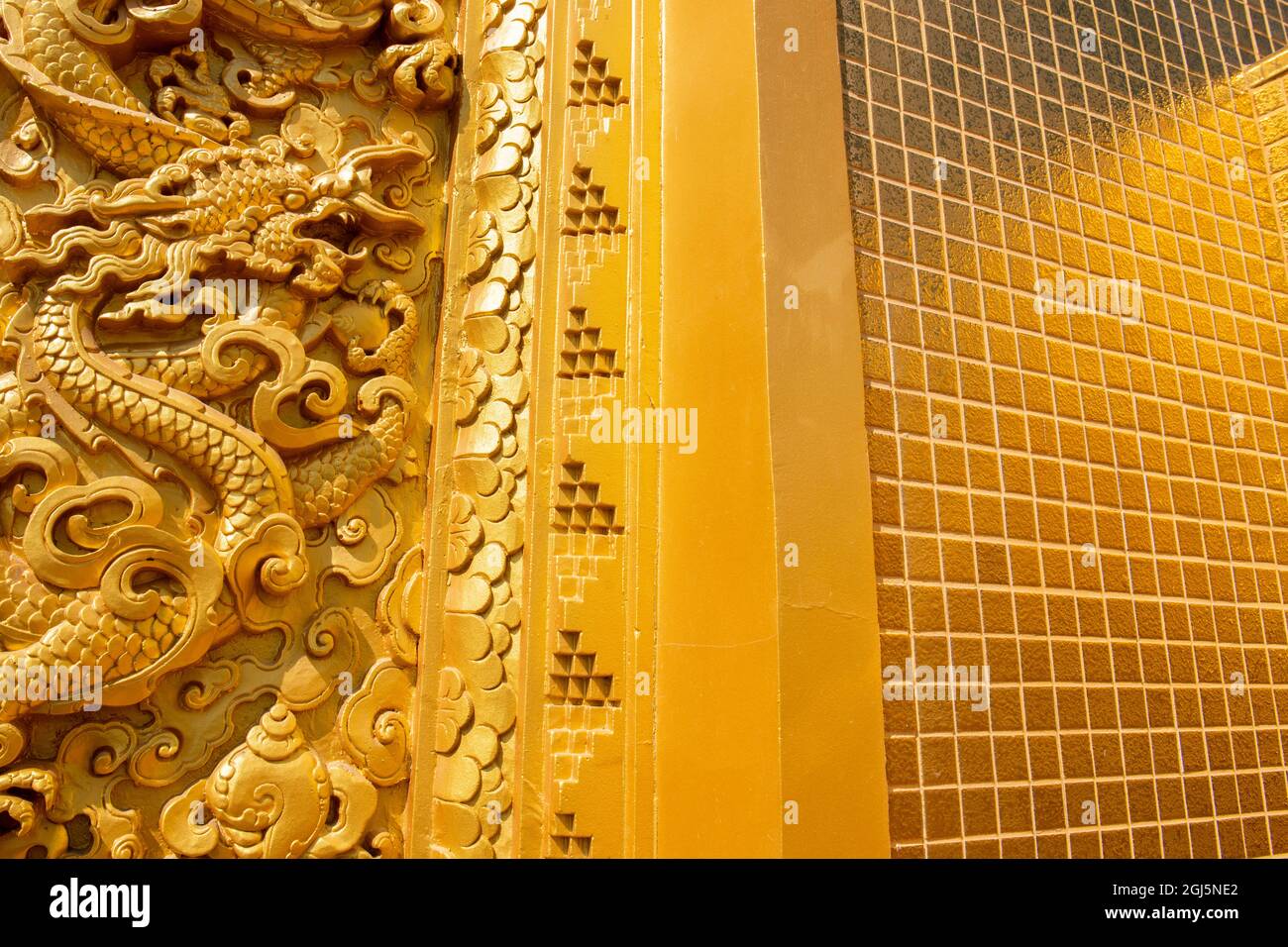 Bhutan. Detail of gold tile architecture with dragon Stock Photo - Alamy