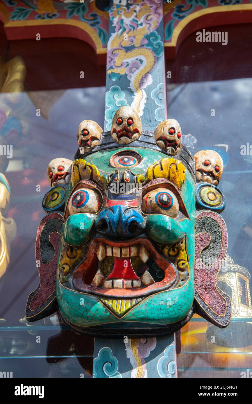 Bhutan, Thimphu. Typical souvenir Bhutanese mask embellished with ...