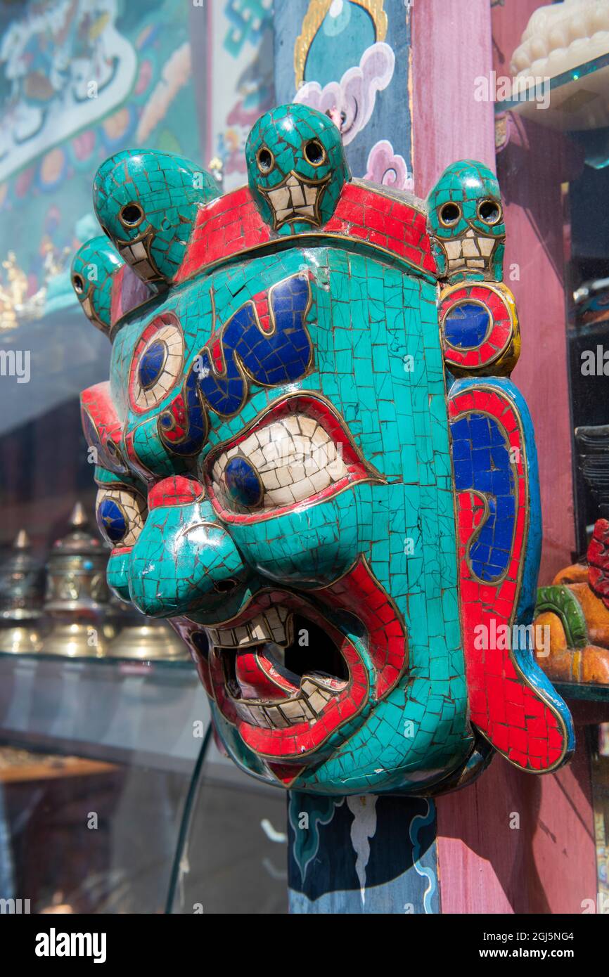 Bhutan, Thimphu. Typical souvenir Bhutanese mask embellished with ...