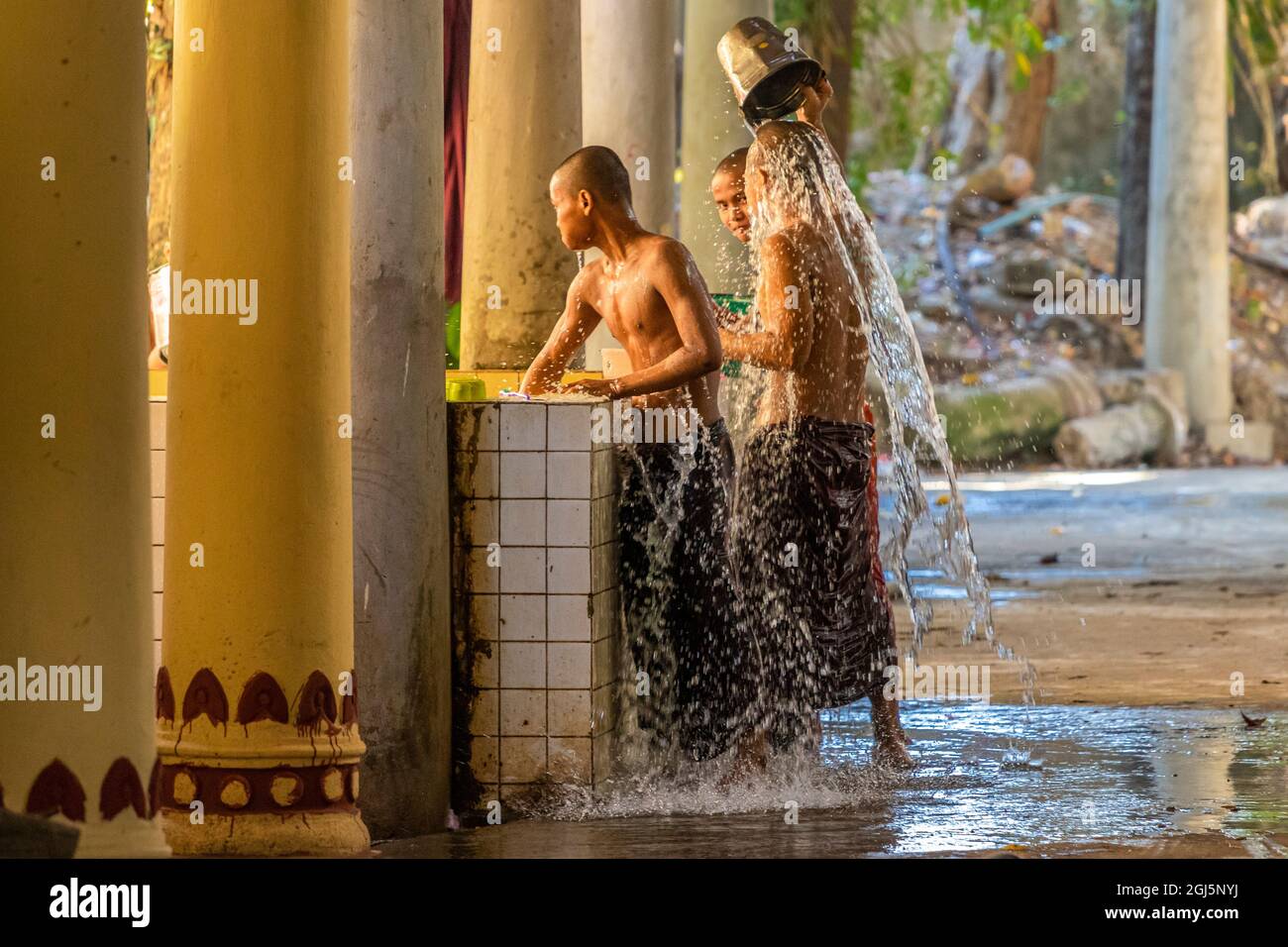 Buddhist monks bathing Stock Photo - Alamy