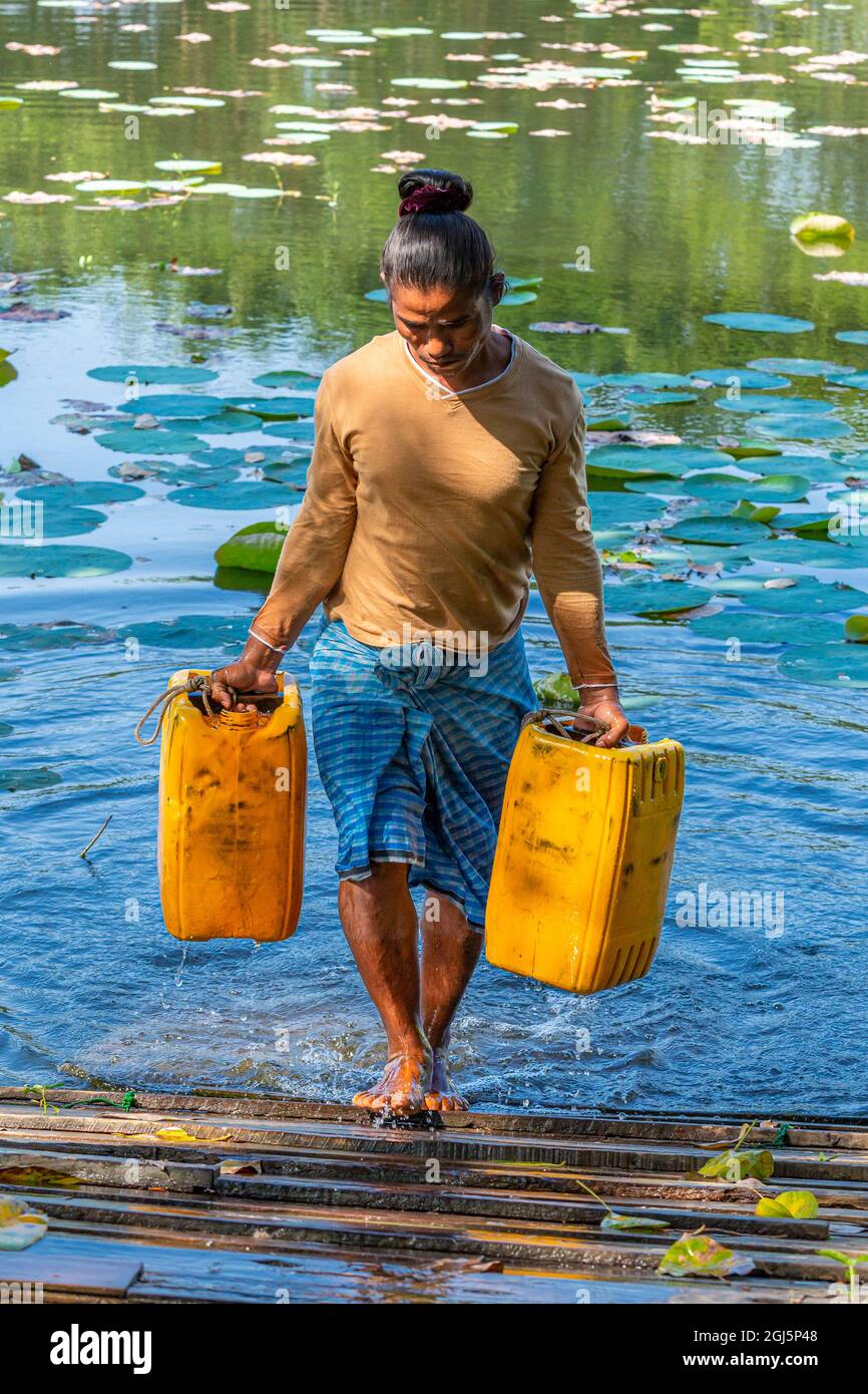 Man collecting water hi-res stock photography and images - Alamy