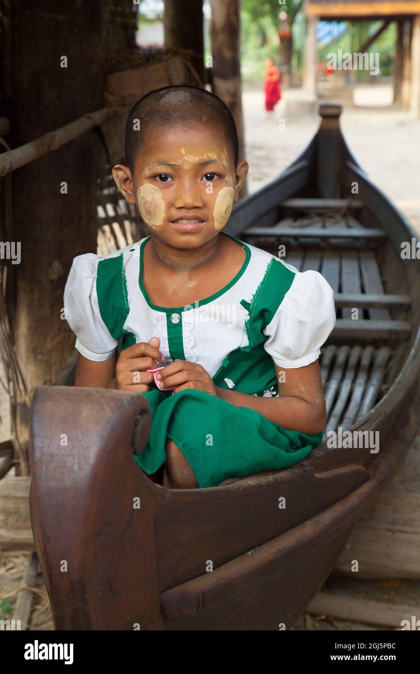 Young Burmese school girl with traditional Thanaka Paste on her face in ...