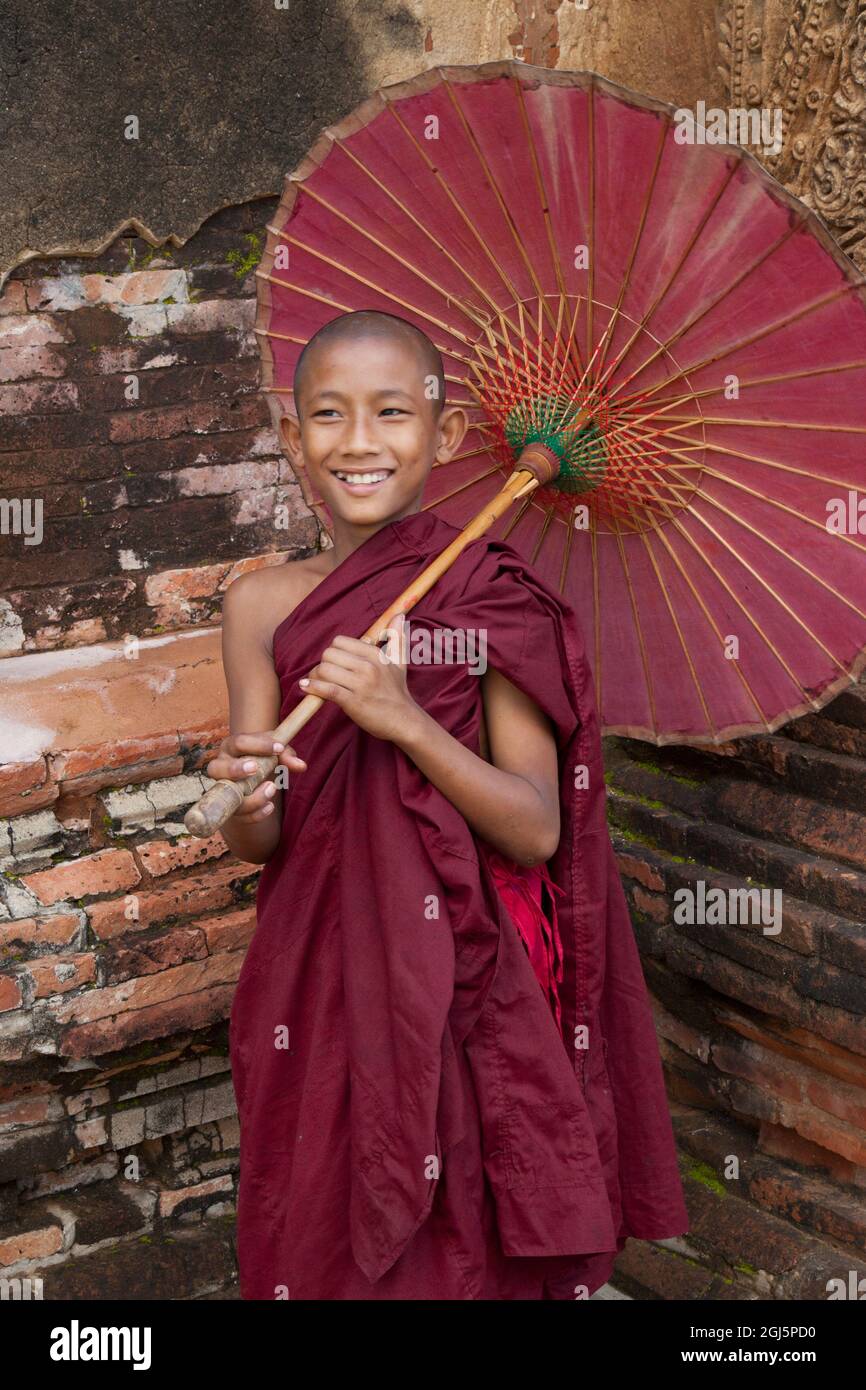 Young monk boy in traditional robes at a temple in Bagan, Myanmar Stock ...