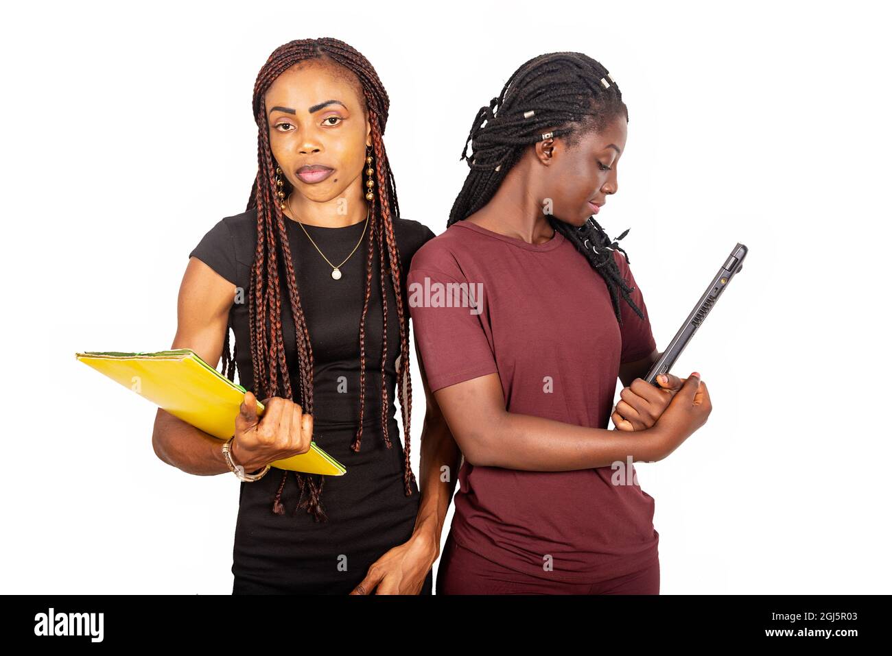 two beautiful female students standing with braids on a white ...