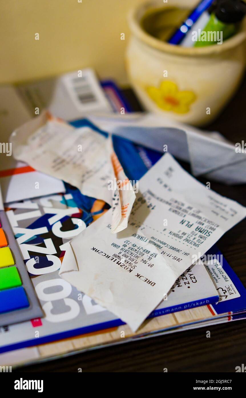 POZNAN, POLAND - Nov 17, 2015: A shopping paper receipt laying on the ...