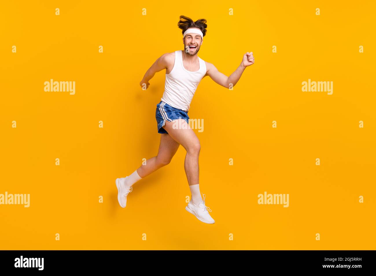Full length body size view of attractive cheerful guy jumping running ...
