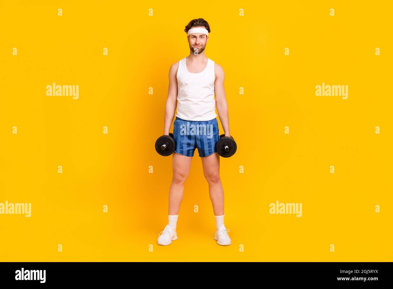 Full length body size view of attractive cheery guy lifting weight ...