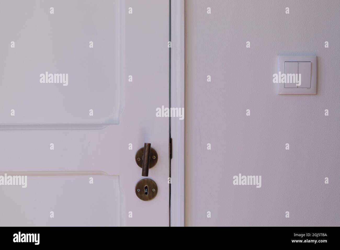 Interiors of a modern house, the door and light switch Stock Photo - Alamy