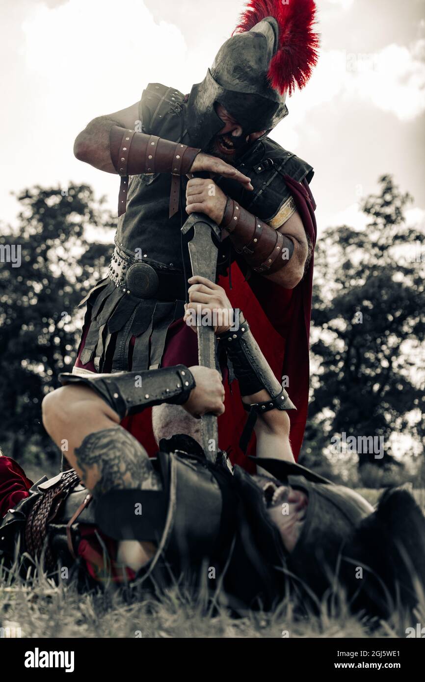 Battle with swords between two ancient greek or roman warriors in ...