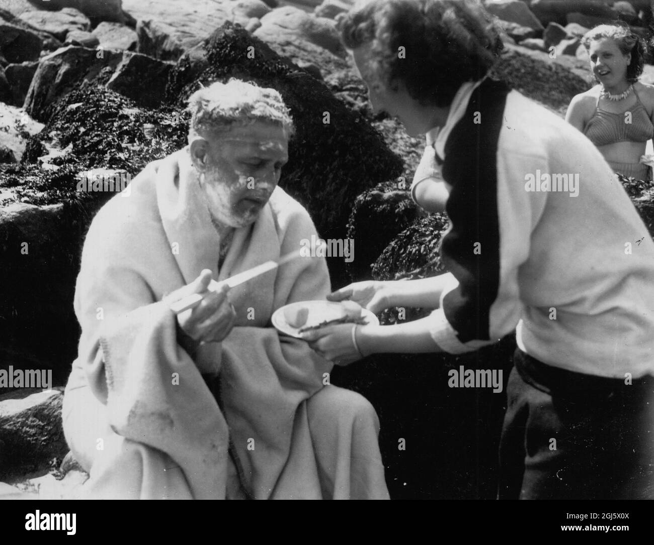 Food on French soil Tom Blower wrapped in a blanket is pictured taking ...