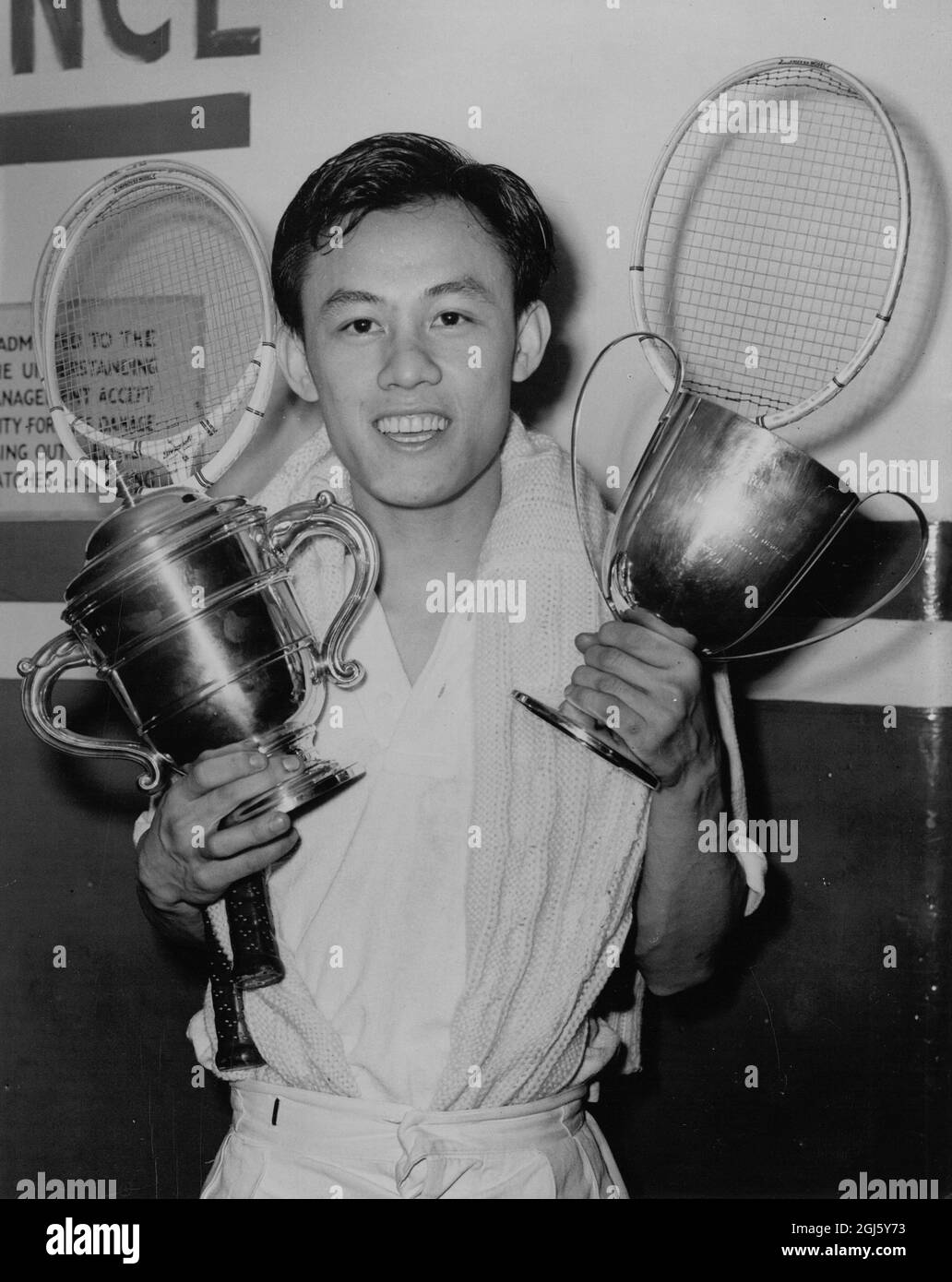 Smiling sportsman with the trophies at Empress Hall , Earl's Court ...