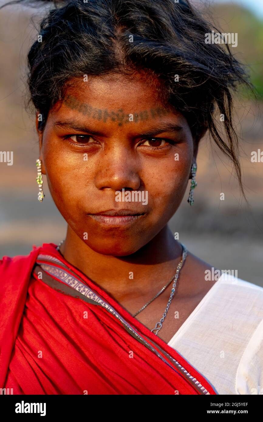 India, Madhya Pradesh. Portrait of a young Indian woman with tattoos on ...