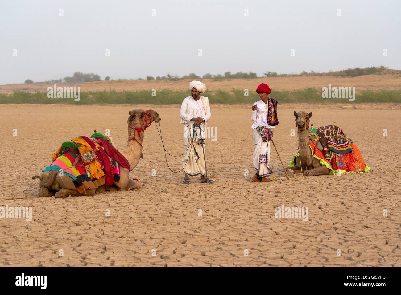 India, Gujarat, Bhuj, Great Rann of Kutch, Tribe. Two men stand with ...