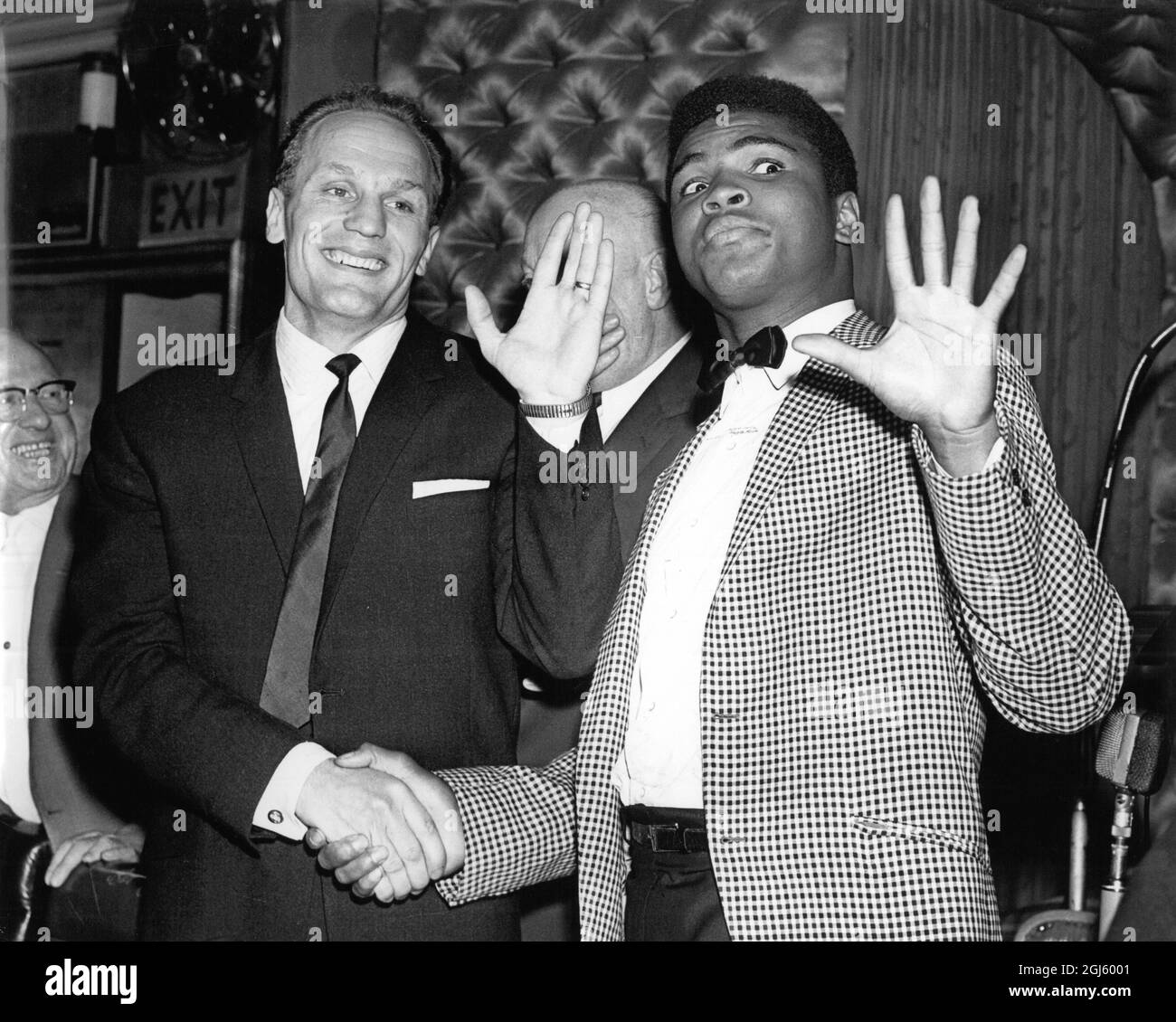 Henry Cooper , the British Heavyweight Champion , shakes hands with his ...
