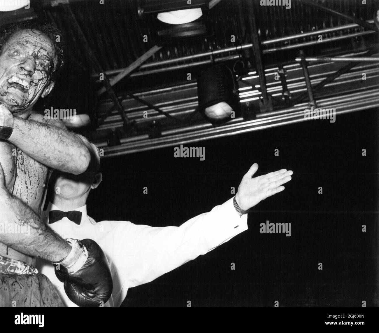 Cassius Clay ( Muhammad Ali ) v Henry Cooper Henry Cooper , with blood ...