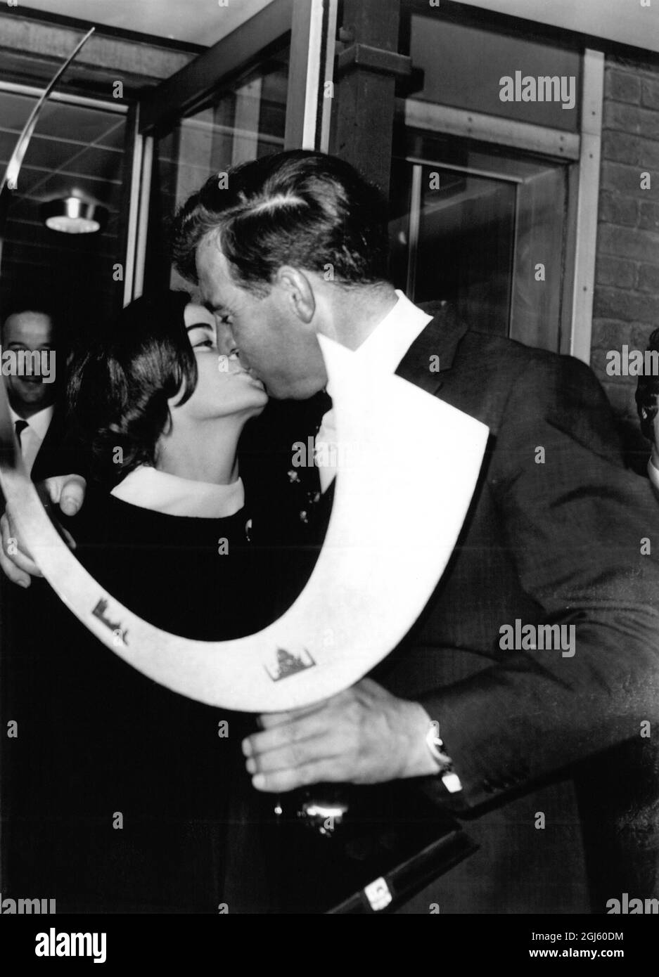 Scottish rally driver Andrew Cowan gets a kiss from his fiancee ...