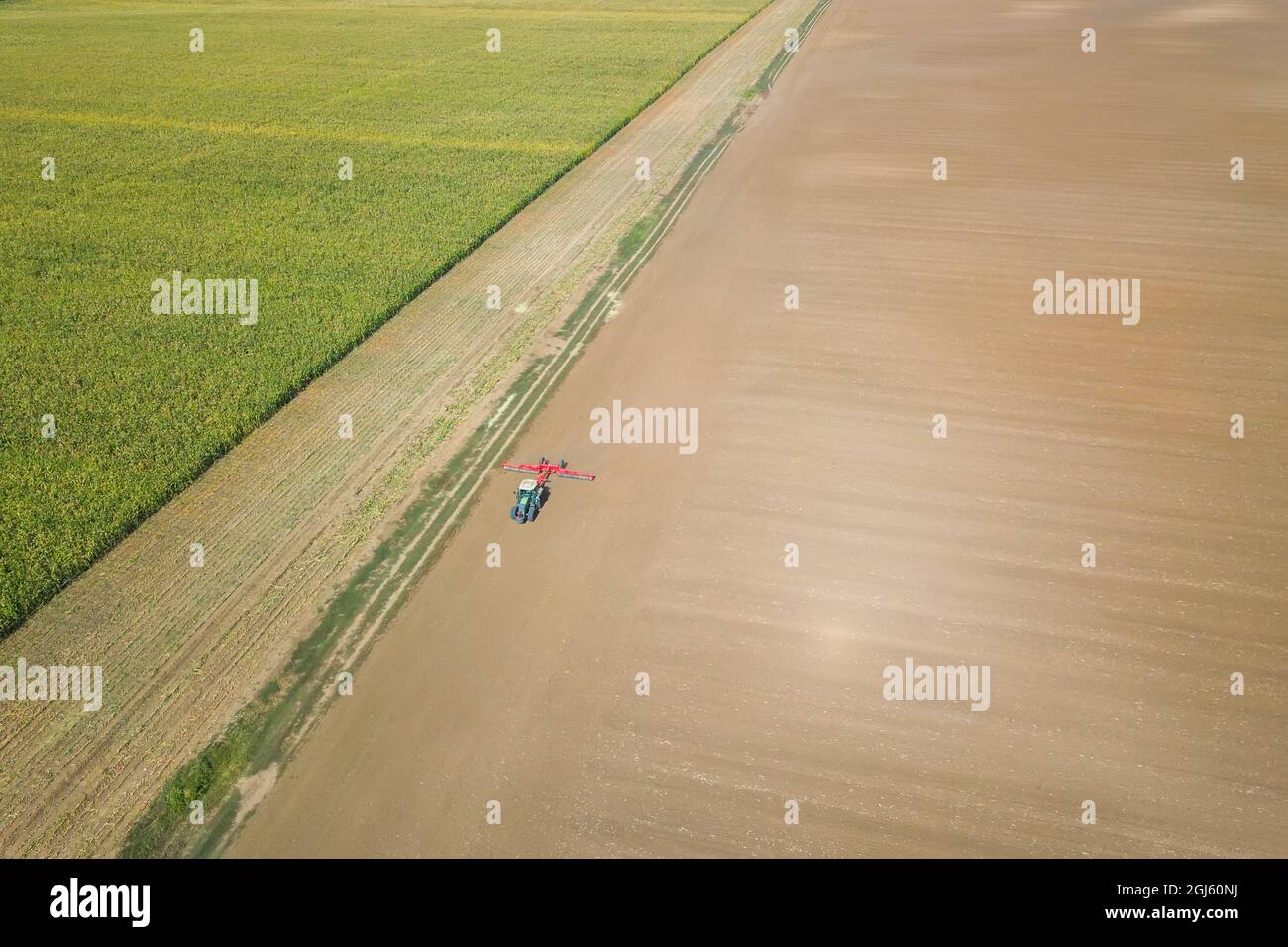 Aerial view Tractor preparing field rolling, Agriculture tractor ...