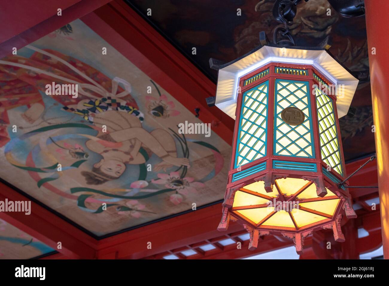 Lantern hanging from a Buddhist temple ceiling with the goddess ...